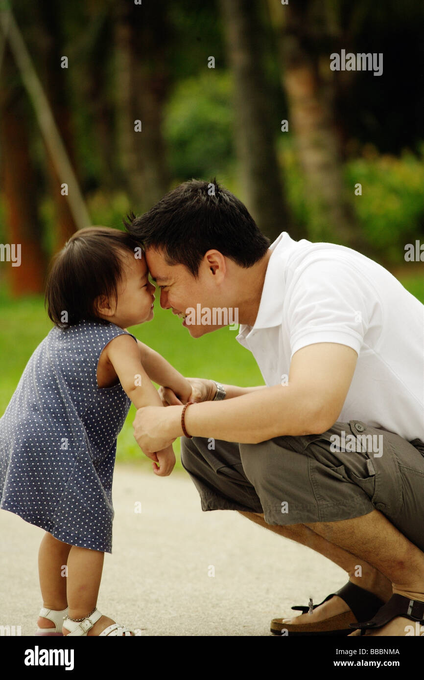 Father face to face with young daughter Stock Photo - Alamy
