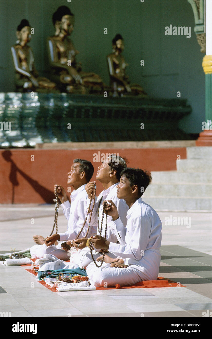 Myanmar (Burma), Yangon (Rangoon), Worshippers praying at the Shwedagon ...