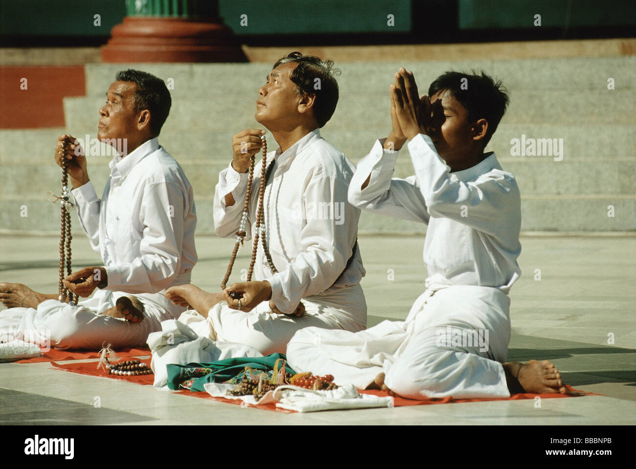 Myanmar (Burma), Yangon (Rangoon), Worshippers praying at the Shwedagon ...