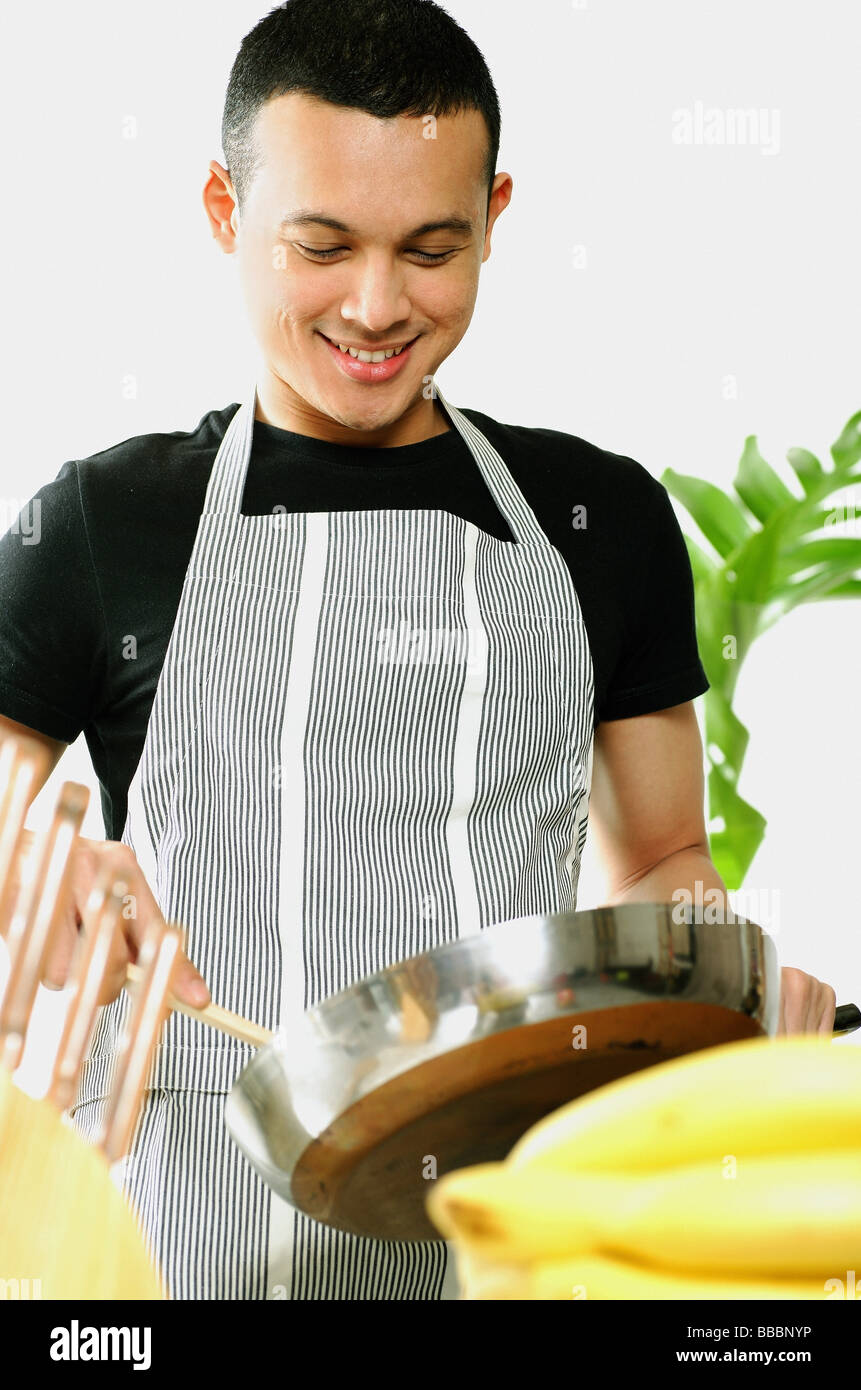 Man wearing black apron hi-res stock photography and images - Alamy