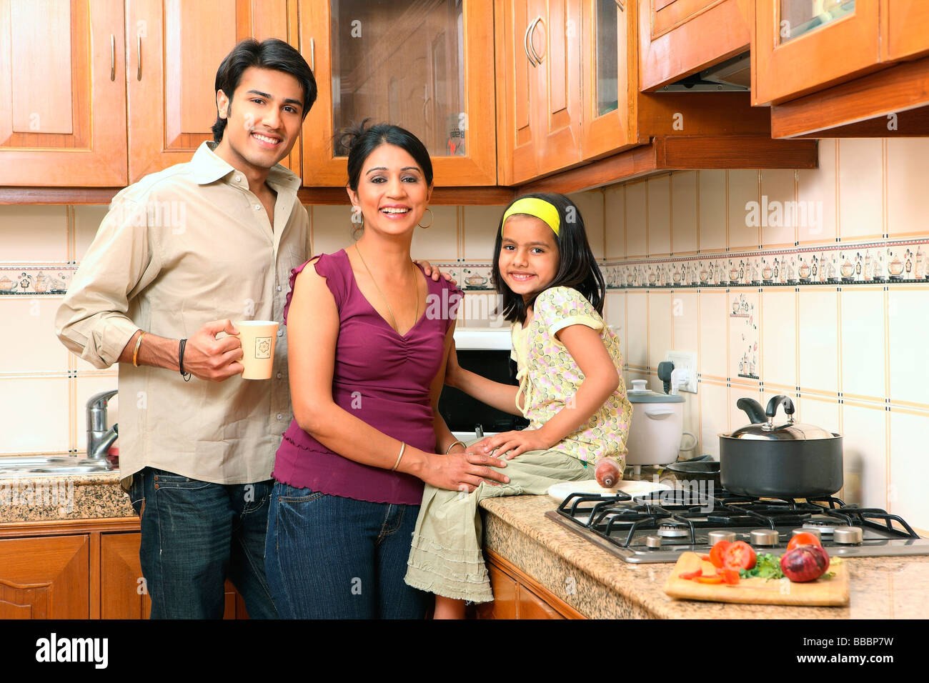 Family in kitchen Stock Photo - Alamy