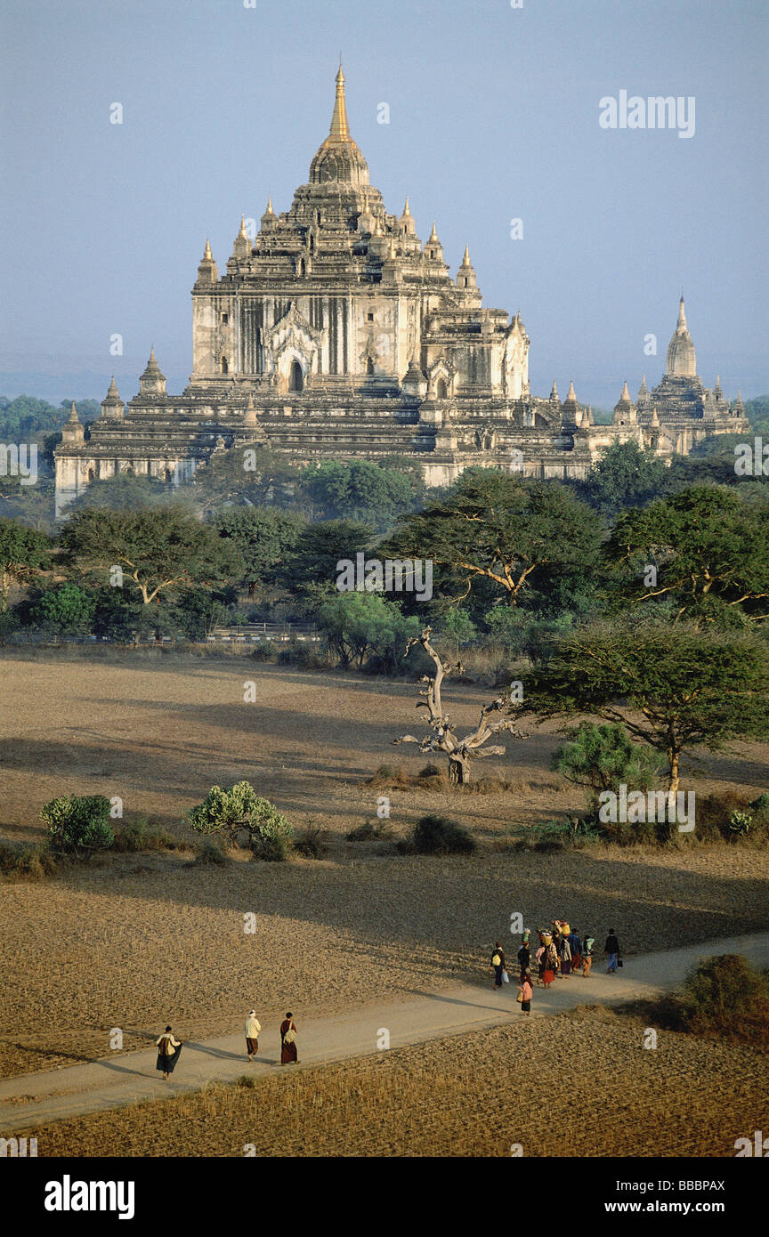 Myanmar (Burma), Bagan, Villagers walking along dirt roads with temples ...