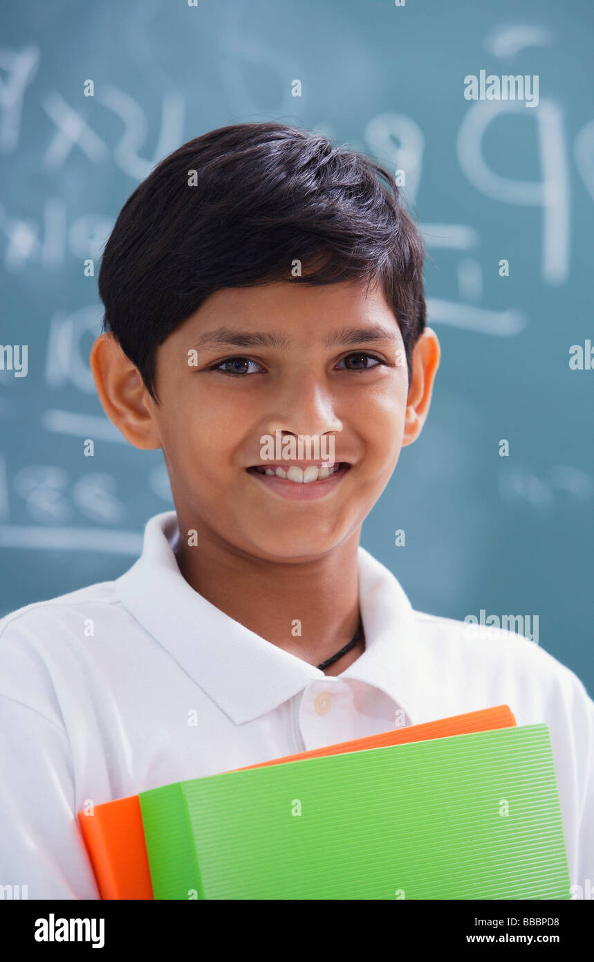 boy holding notebooks Stock Photo - Alamy