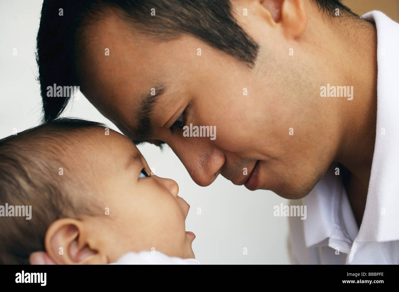 Father bonding with baby daughter Stock Photo - Alamy