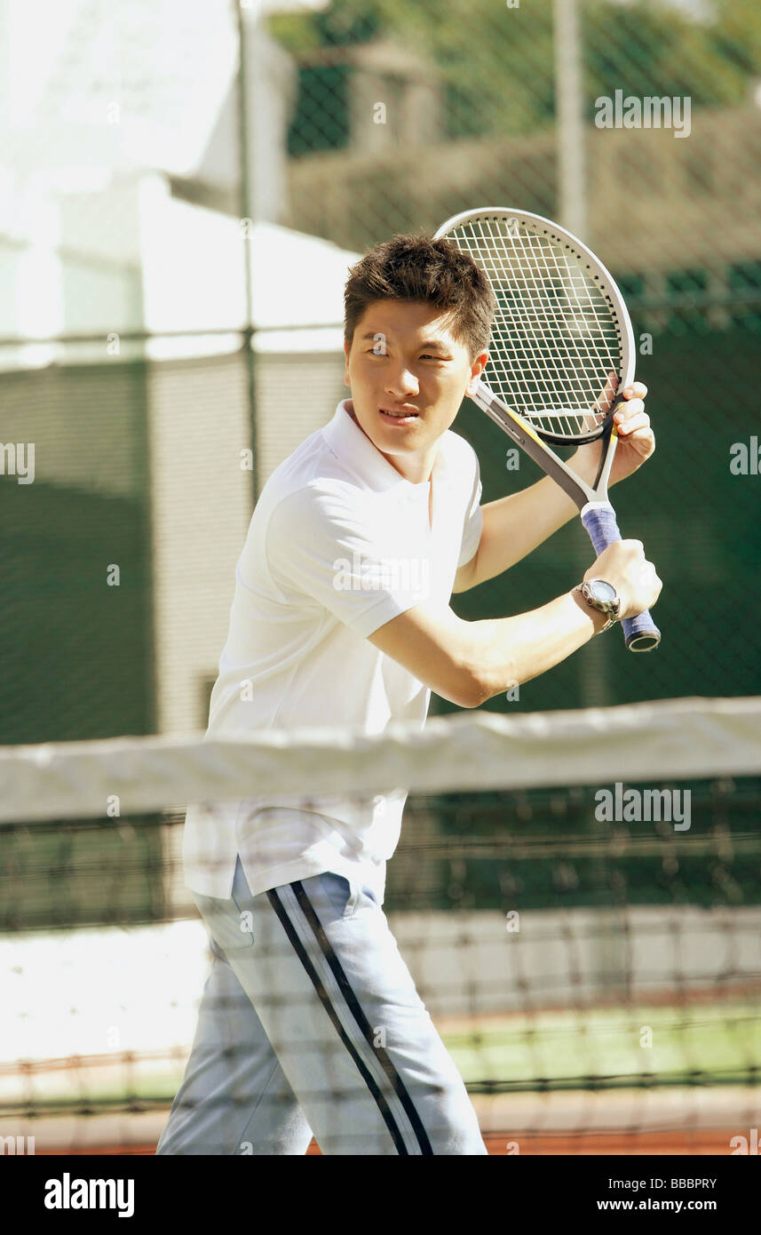 Man playing tennis Stock Photo - Alamy