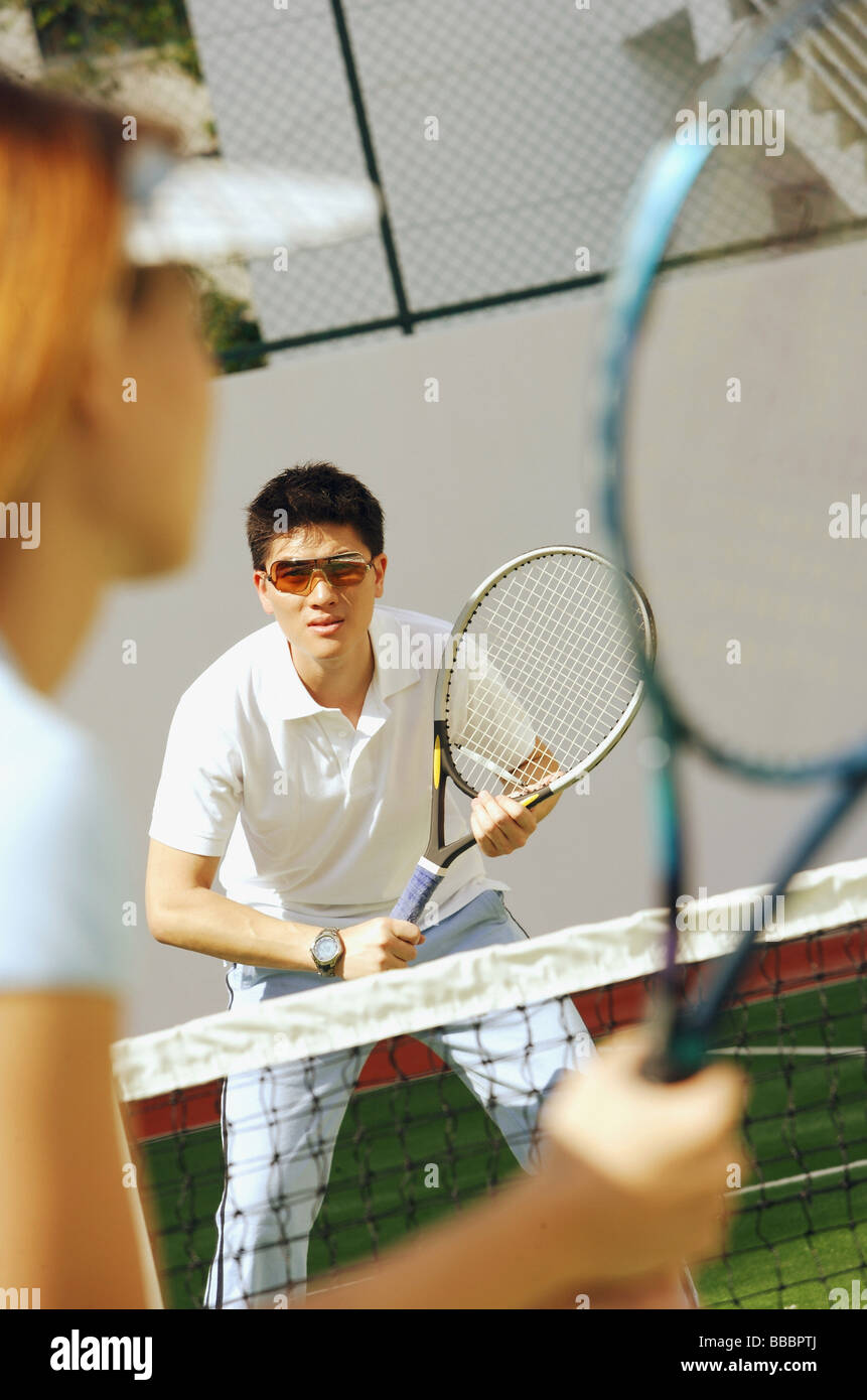 Woman holding tennis racket, playing tennis Stock Photo - Alamy