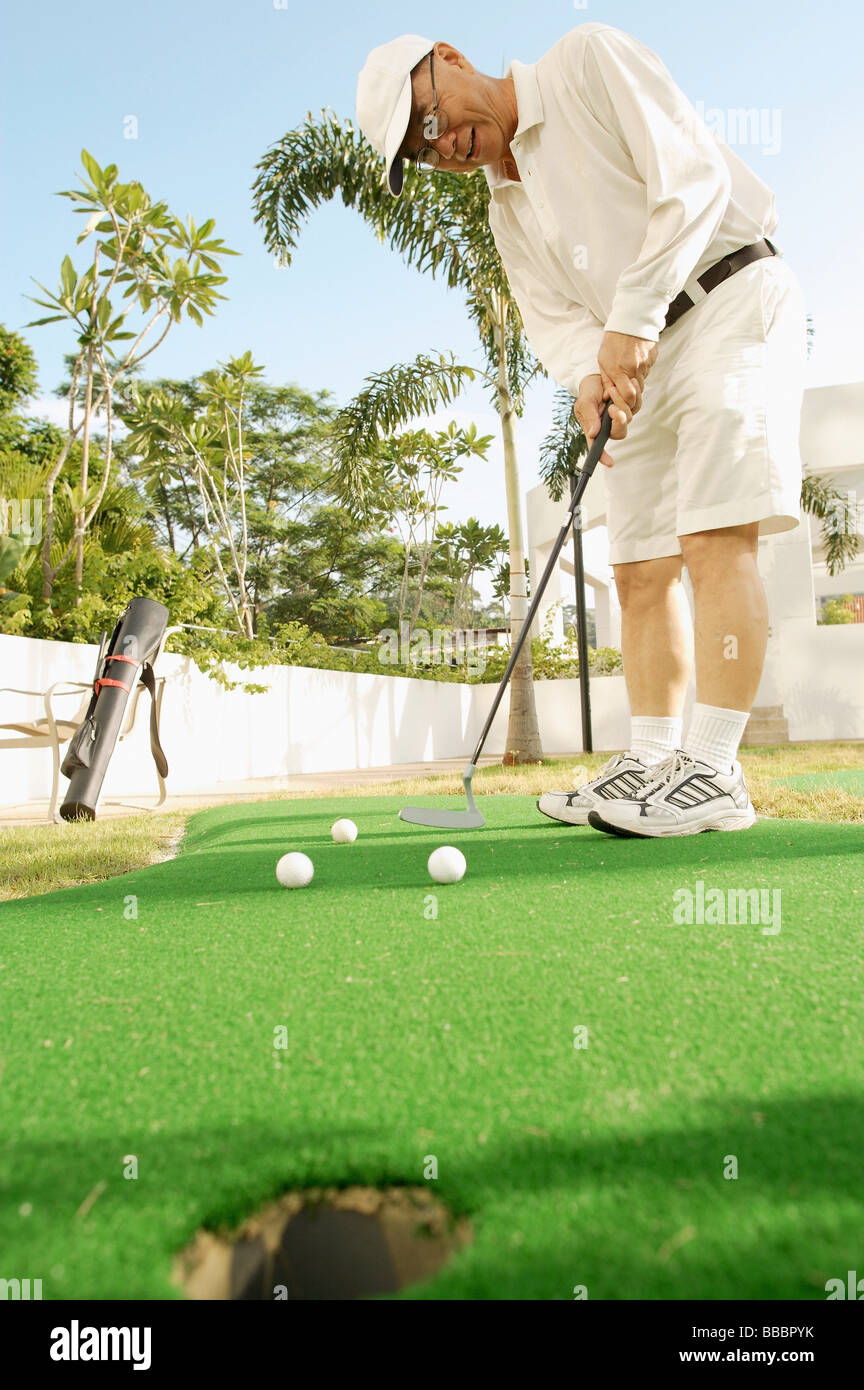 Chinese man playing golf hi-res stock photography and images - Alamy
