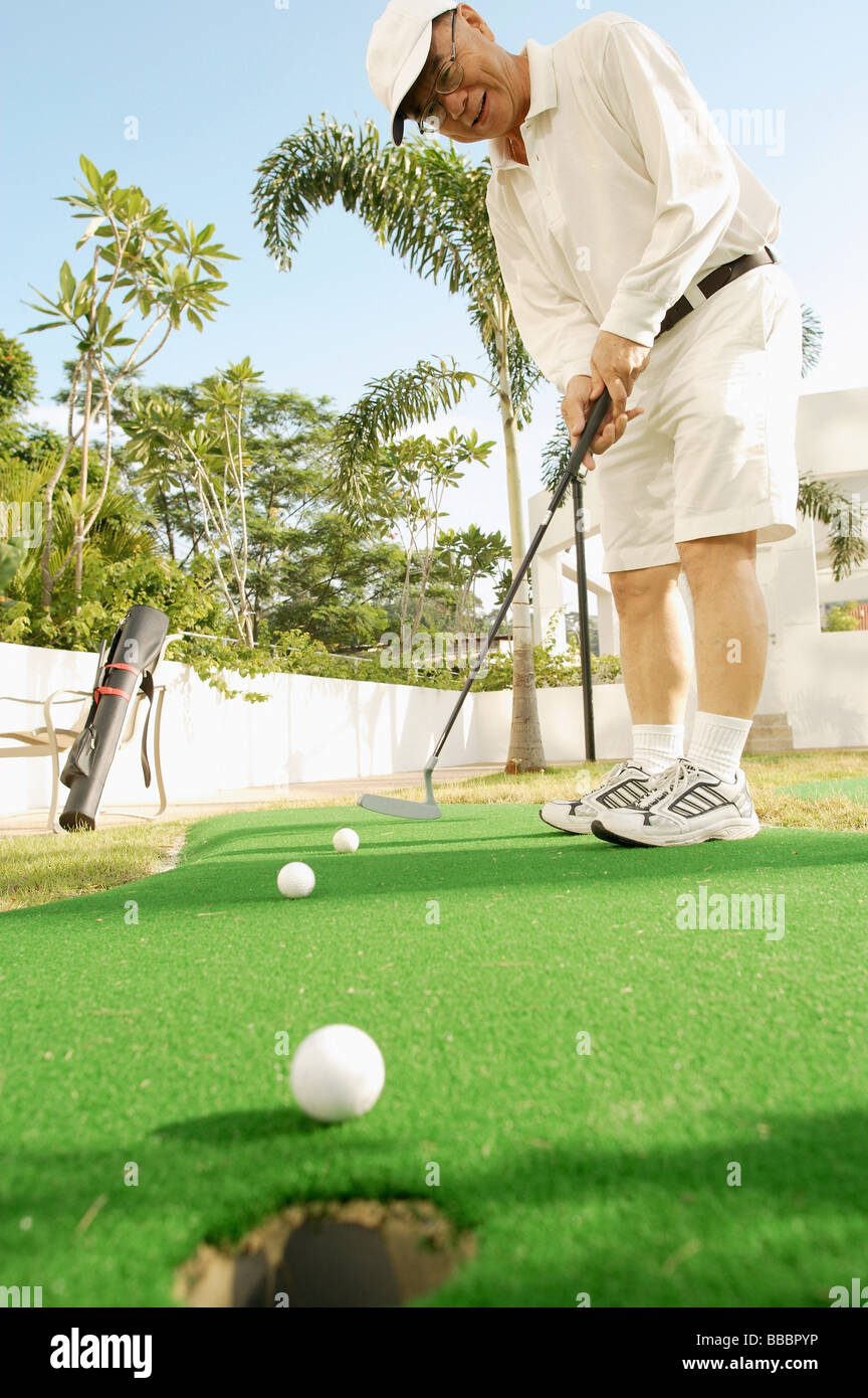 Asian chinese man holding golf hi-res stock photography and images - Alamy