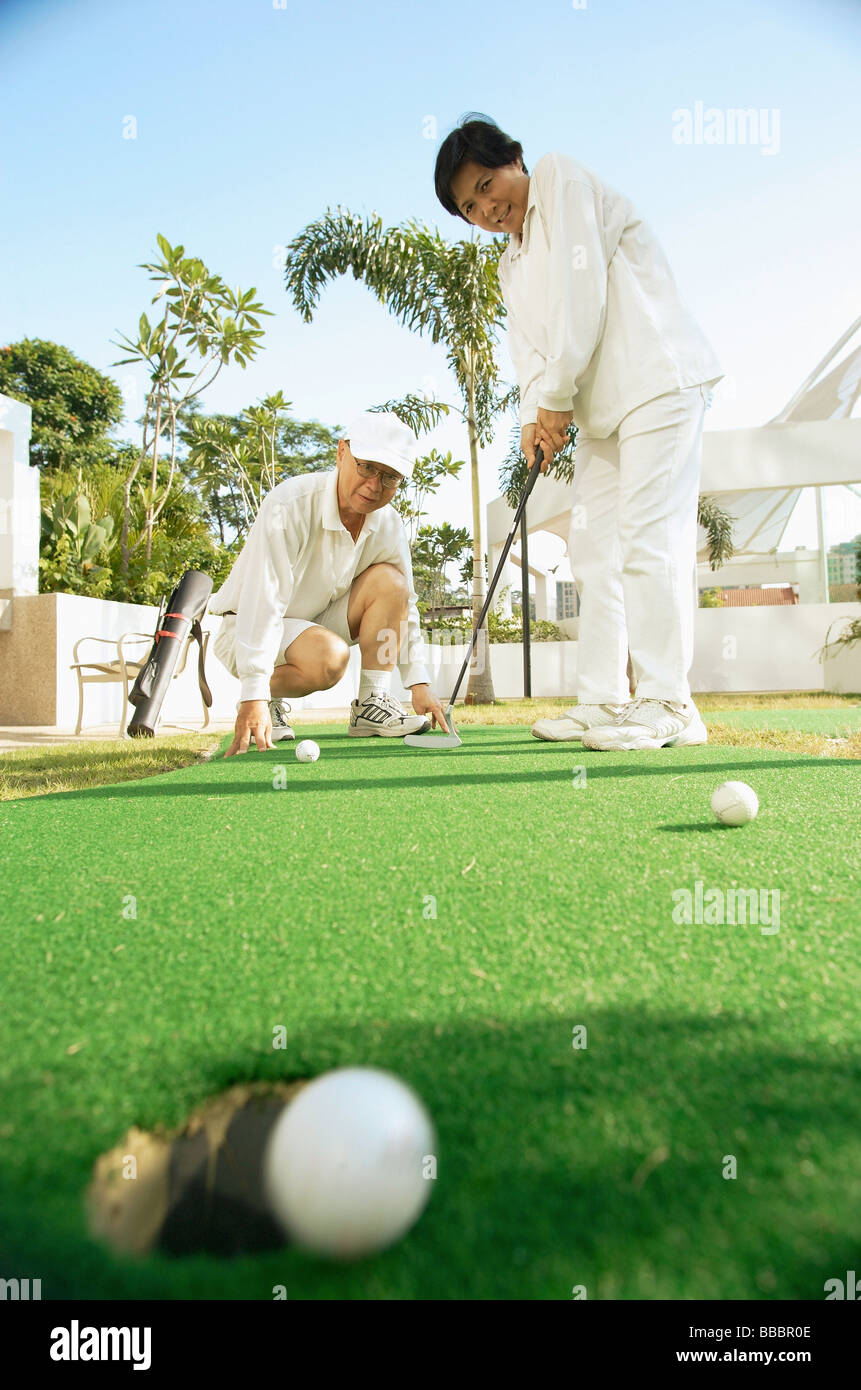 Man crouching playing golf hi-res stock photography and images - Alamy