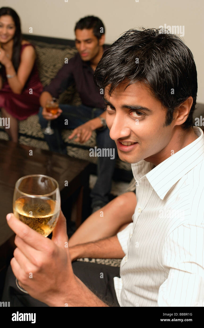 man facing camera with glass of wine Stock Photo - Alamy