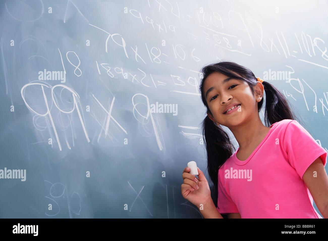 girl working at chalkboard, facing camera (horizontal Stock Photo - Alamy