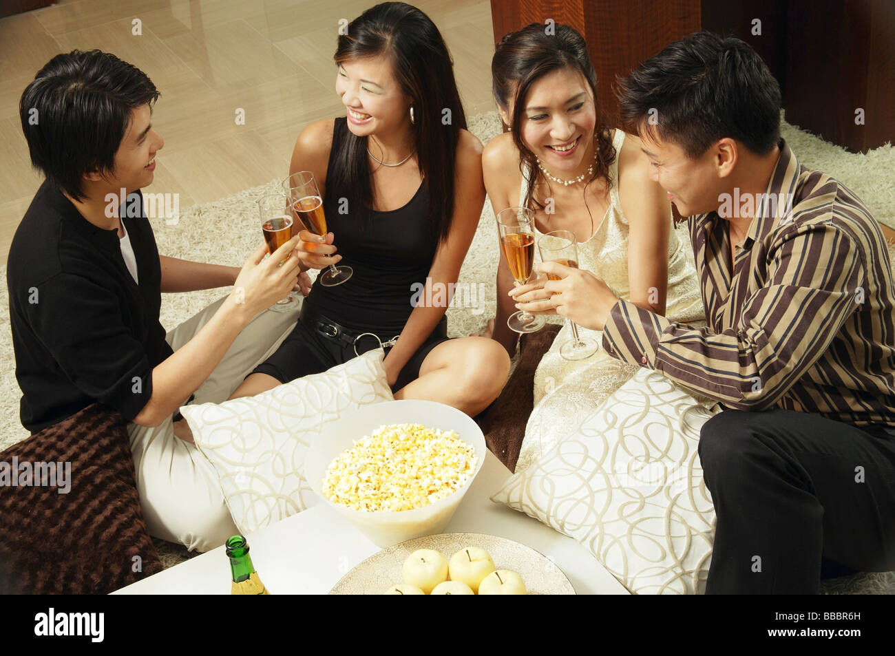 Couples at home toasting with champagne Stock Photo - Alamy