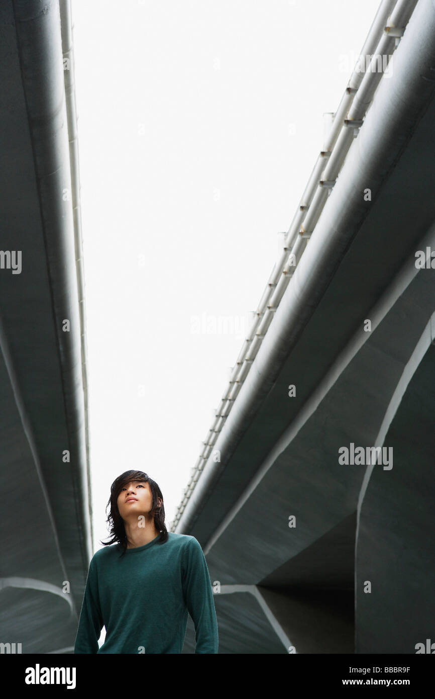 young man under freeway overpass Stock Photo - Alamy