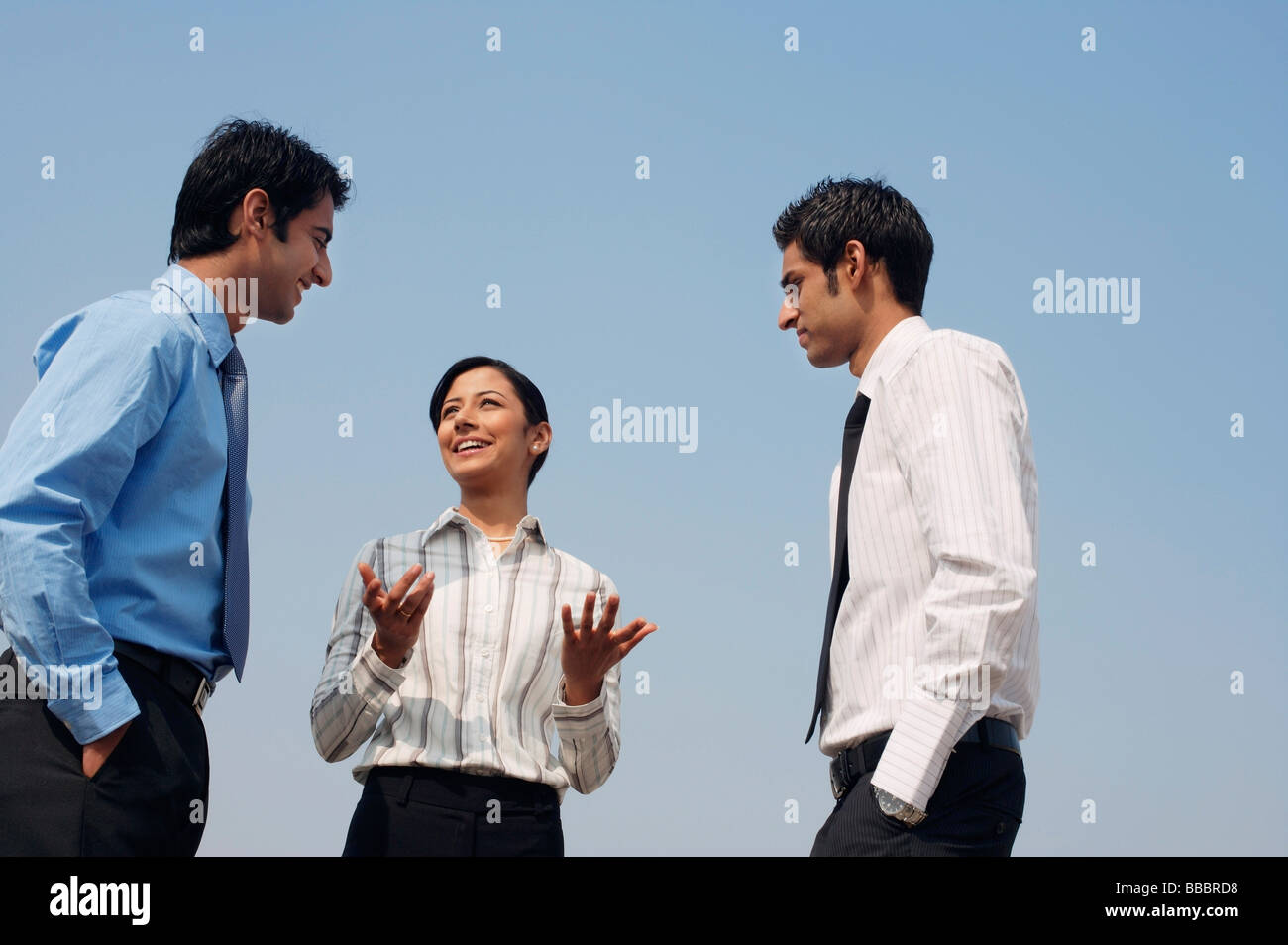 three business colleagues, conversing Stock Photo - Alamy
