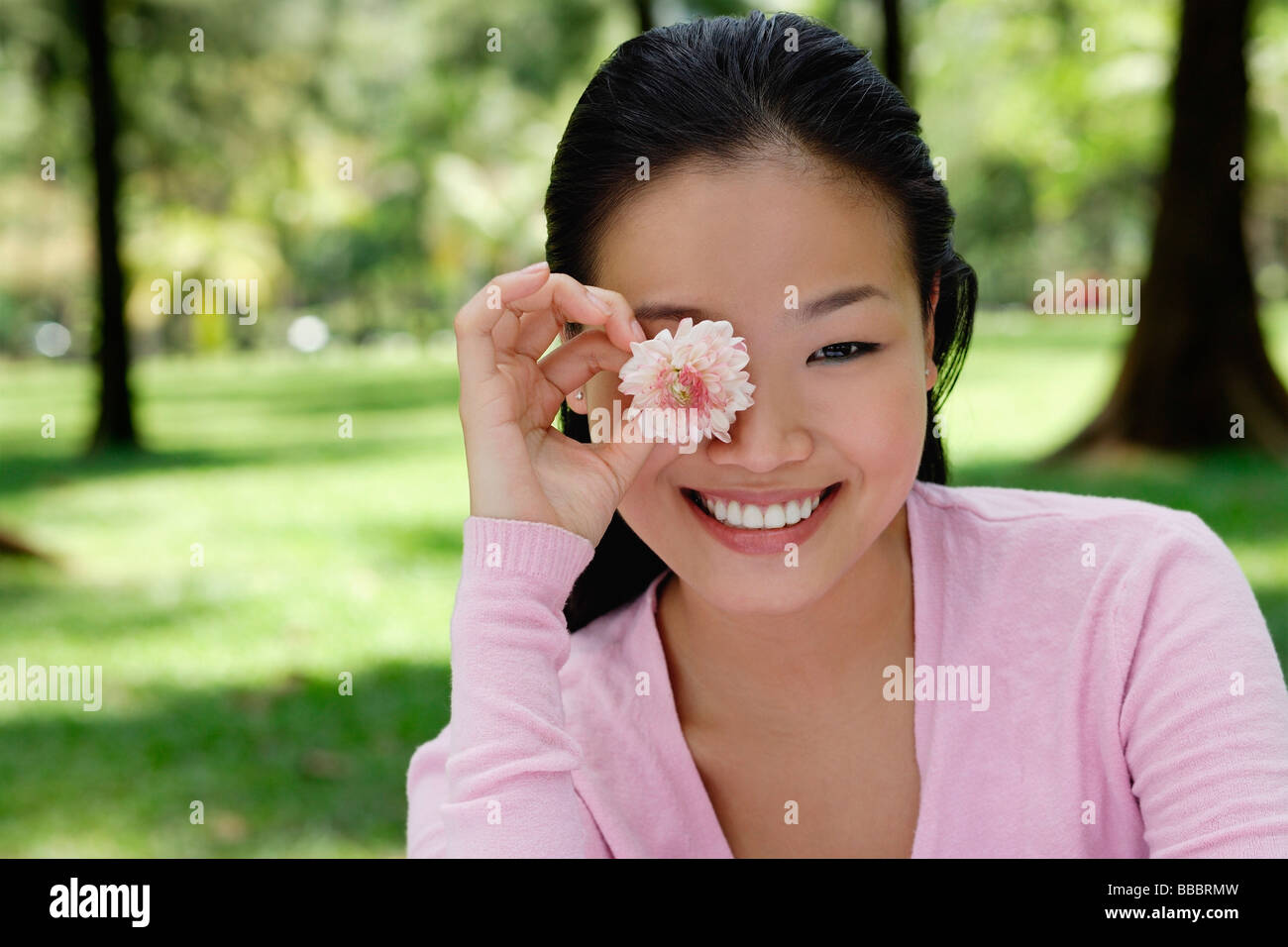 Woman flower over one eye hi-res stock photography and images - Alamy