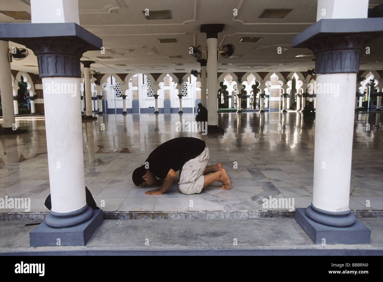Malaysia, Kuala Lumpur, Muslim man praying at National Mosque (Masjid ...