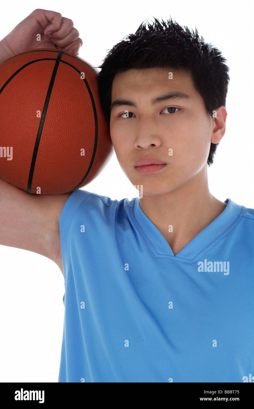 Young man with basketball, portrait Stock Photo - Alamy