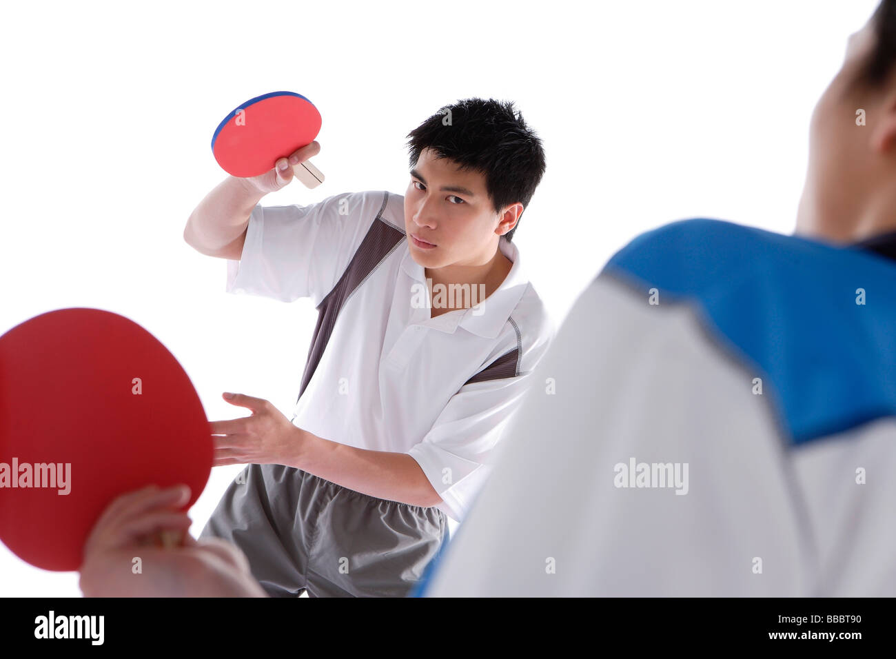 Young men playing table tennis Stock Photo - Alamy