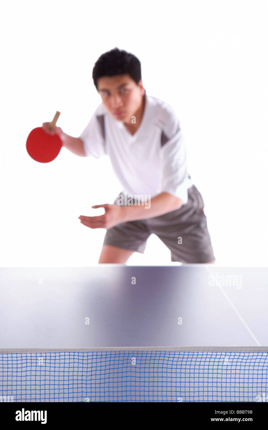 Young man playing table tennis Stock Photo - Alamy