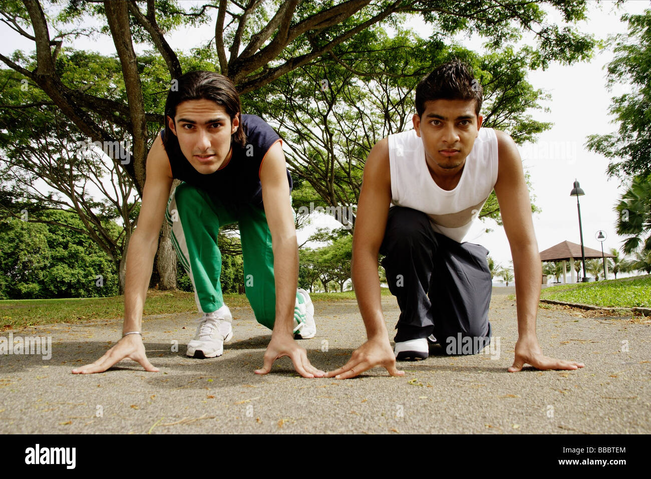 Young men in starting position Stock Photo - Alamy