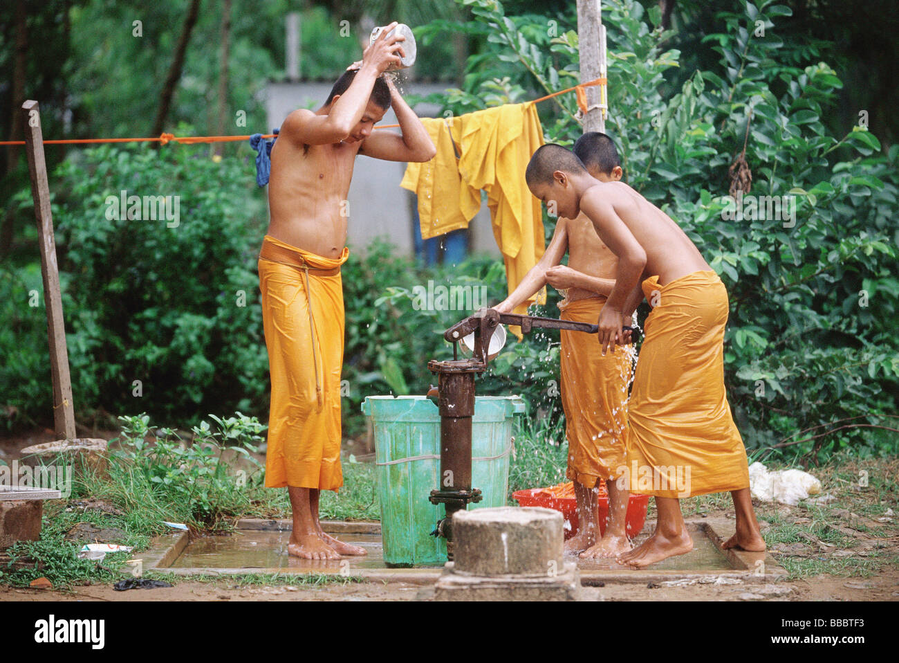 Vietnam, Mekong Delta region, Bac Lieu, Buddhist monks bathing at water pump Stock Photo - Alamy