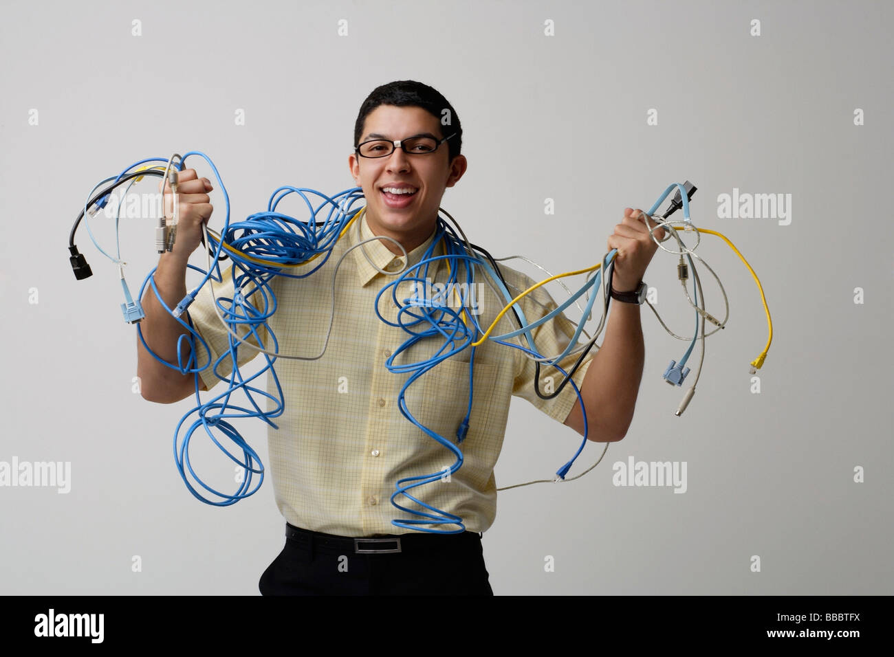 Man with cords and wires around his neck Stock Photo - Alamy