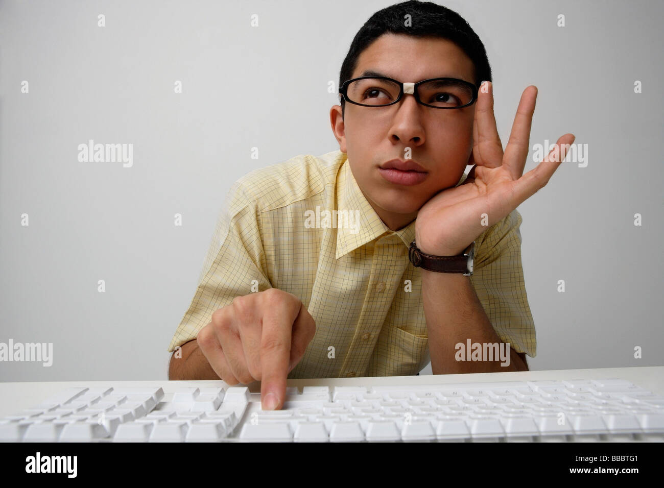 nerd working on keyboard Stock Photo - Alamy