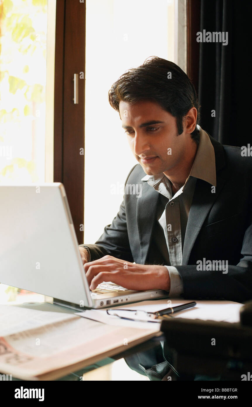 business man working at laptop Stock Photo - Alamy