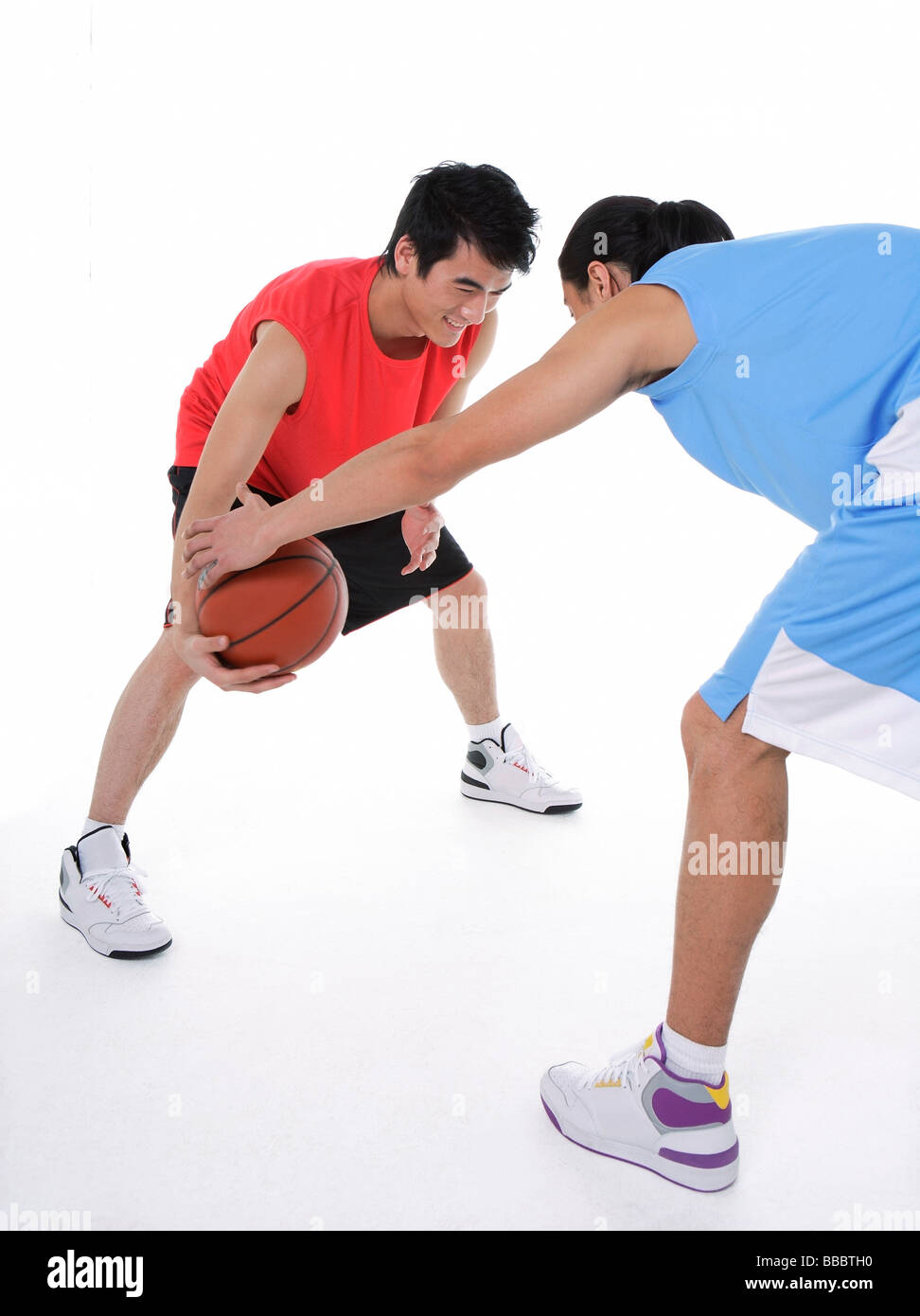 Two men playing basketball Stock Photo - Alamy
