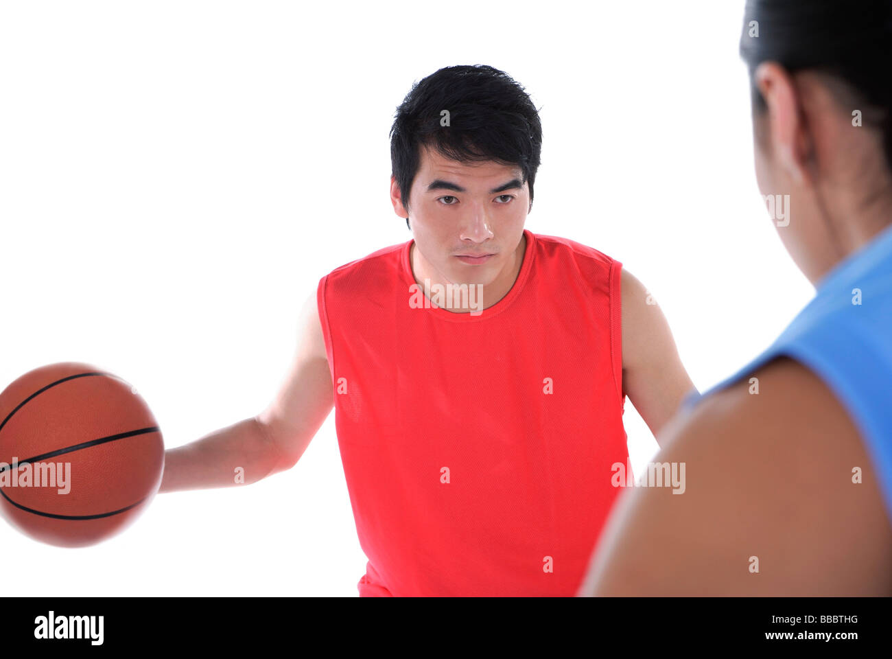 Two men playing basketball, over the shoulder view Stock Photo - Alamy
