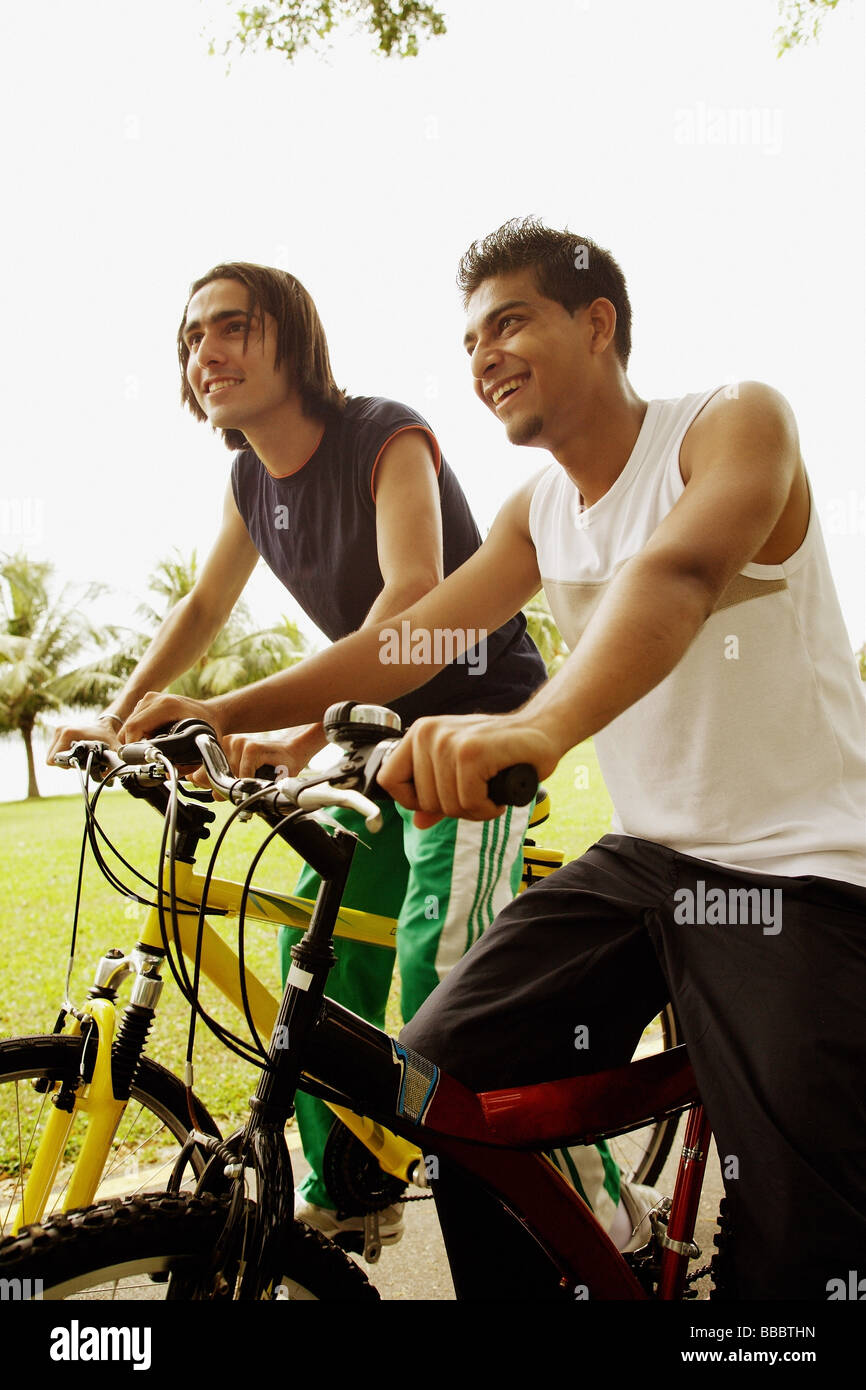 Two young men on bicycles Stock Photo - Alamy