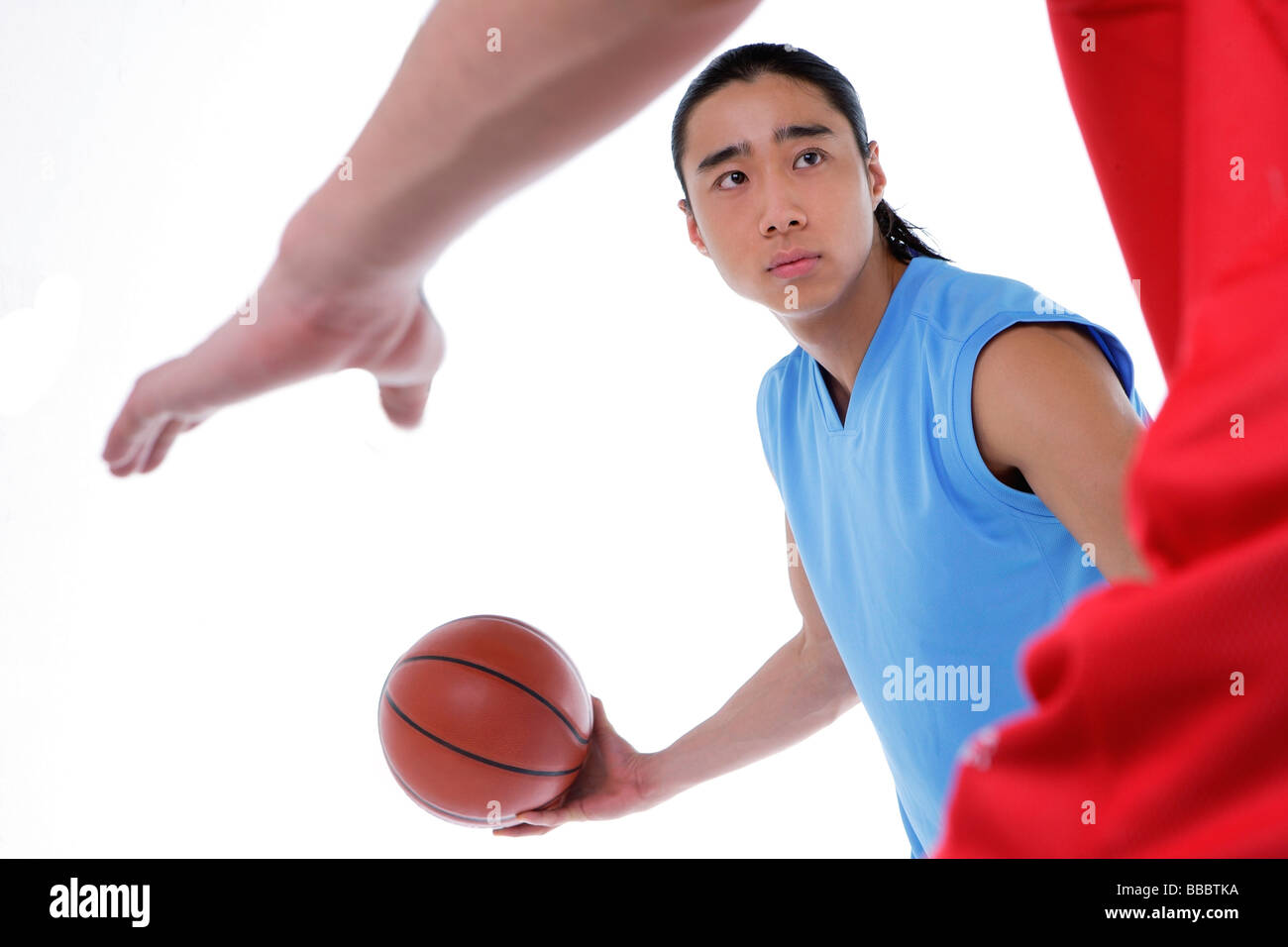 Two men playing basketball, studio shot Stock Photo - Alamy