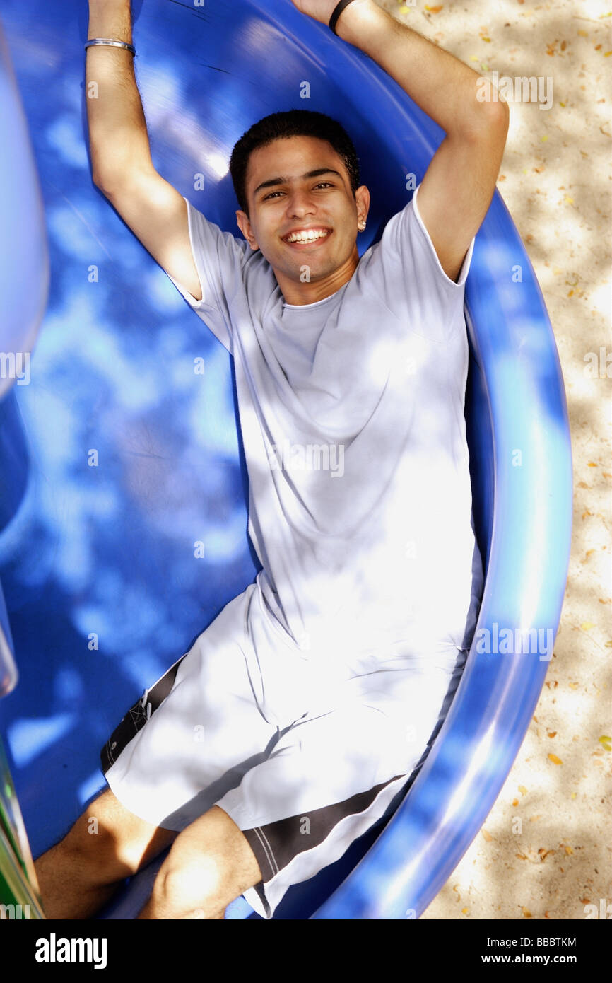 Adult man sliding down slide hi-res stock photography and images - Alamy