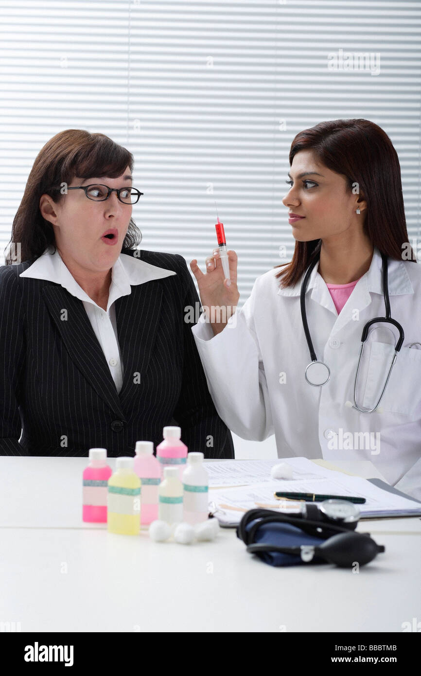 Frightened patient with Doctor Stock Photo - Alamy