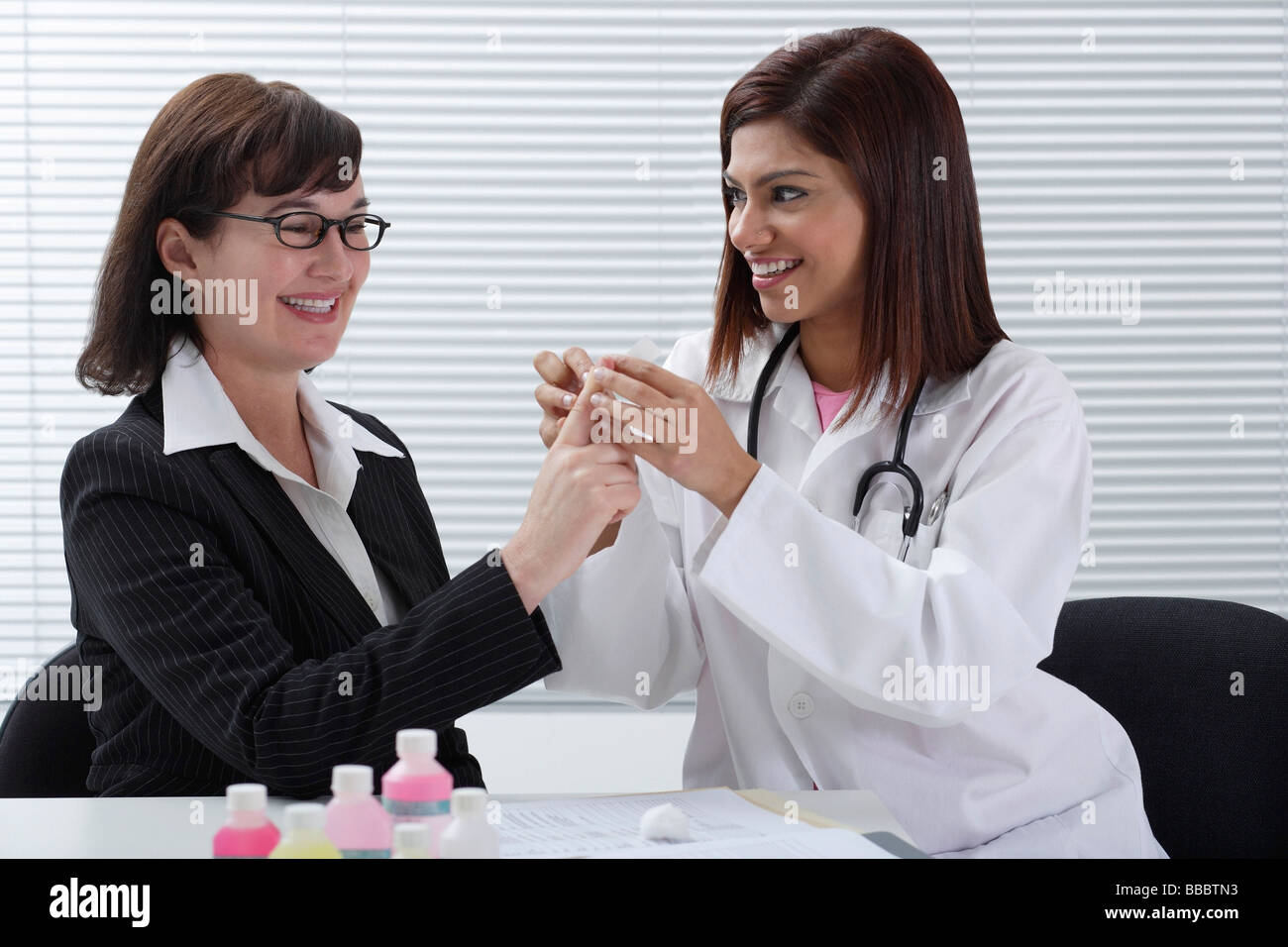 Indian nurse helping patient hi-res stock photography and images - Alamy