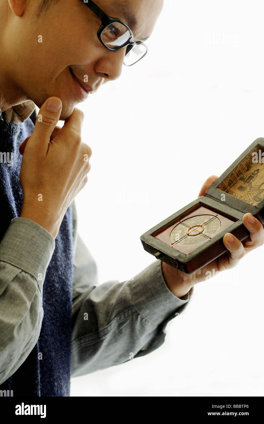 Man with chinese compass hi-res stock photography and images - Alamy