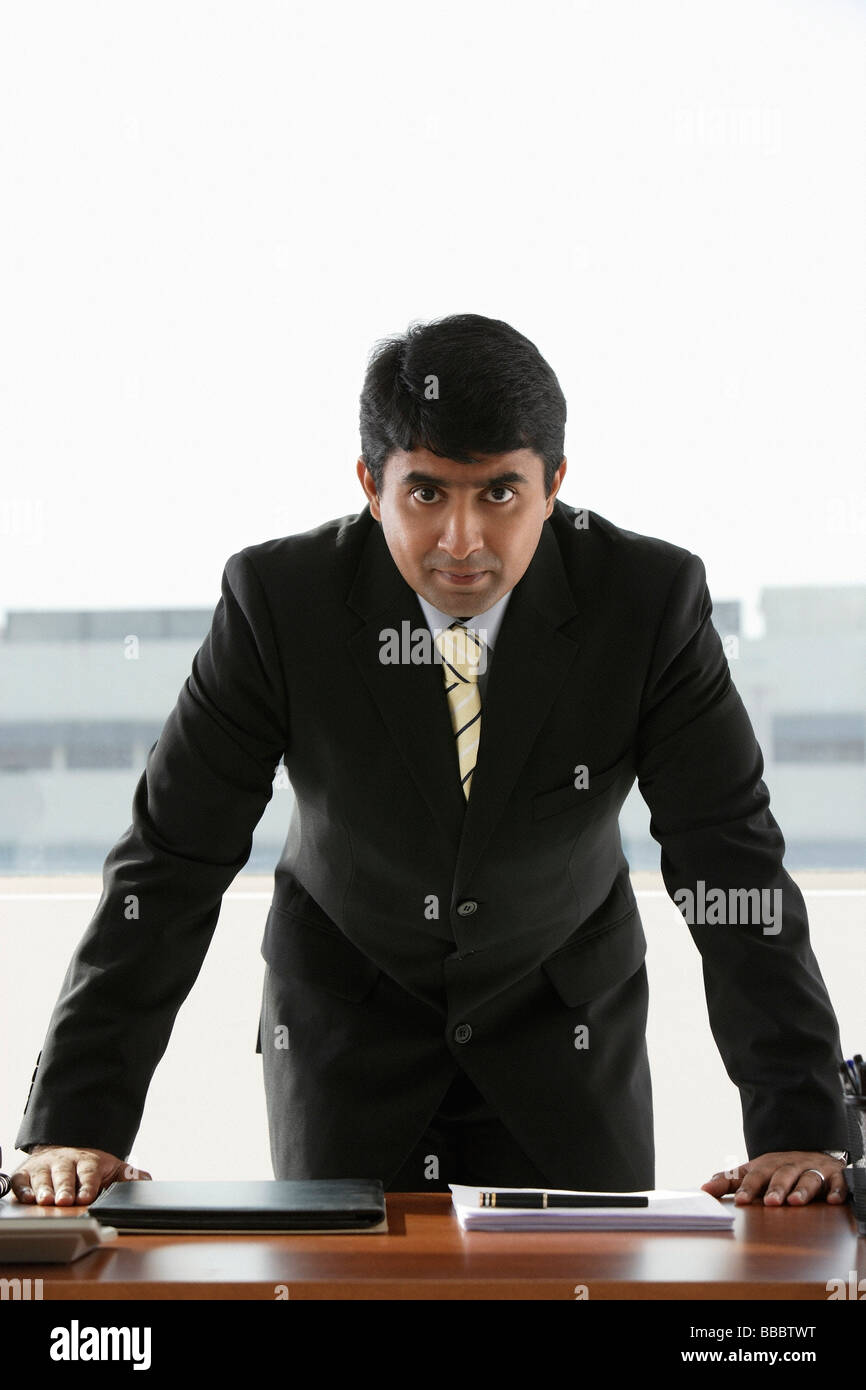 business man standing at desk Stock Photo - Alamy