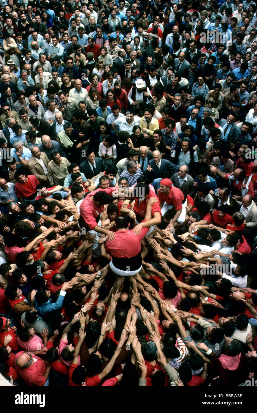Spain, Catalonia. Castellers - human castle building. Men and children ...