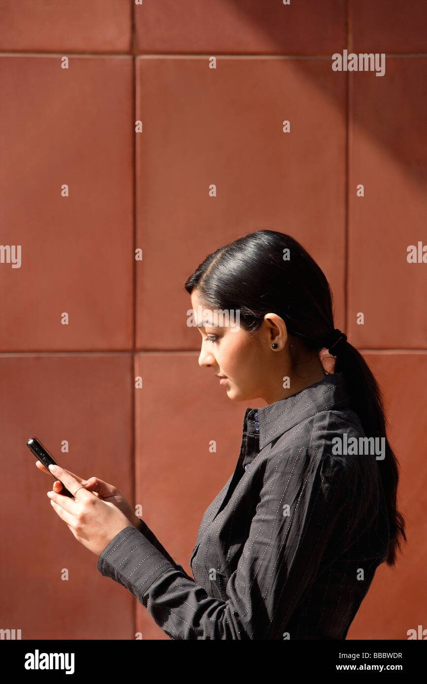 woman reading messages (vertical Stock Photo - Alamy