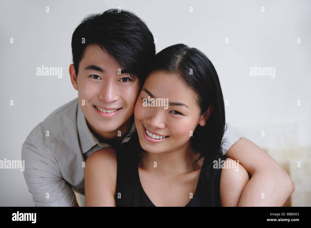 Couple embracing, portrait Stock Photo - Alamy