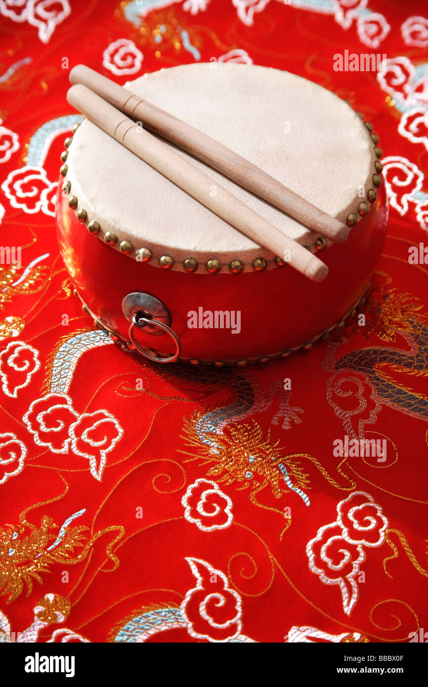 Still life of Chinese drum on Chinese silk fabric Stock Photo - Alamy