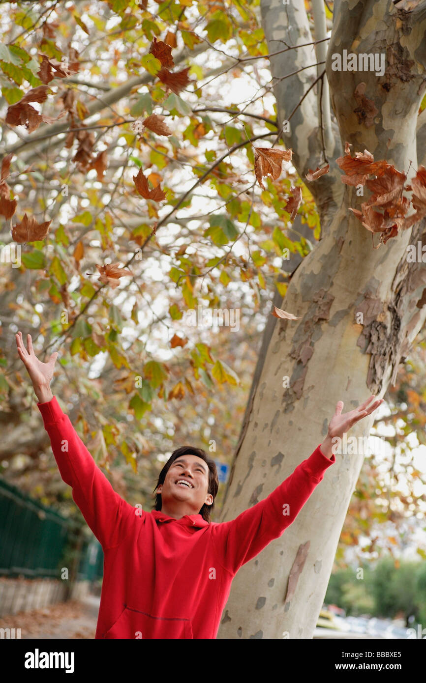 Man standing beneath a tree hi-res stock photography and images - Alamy
