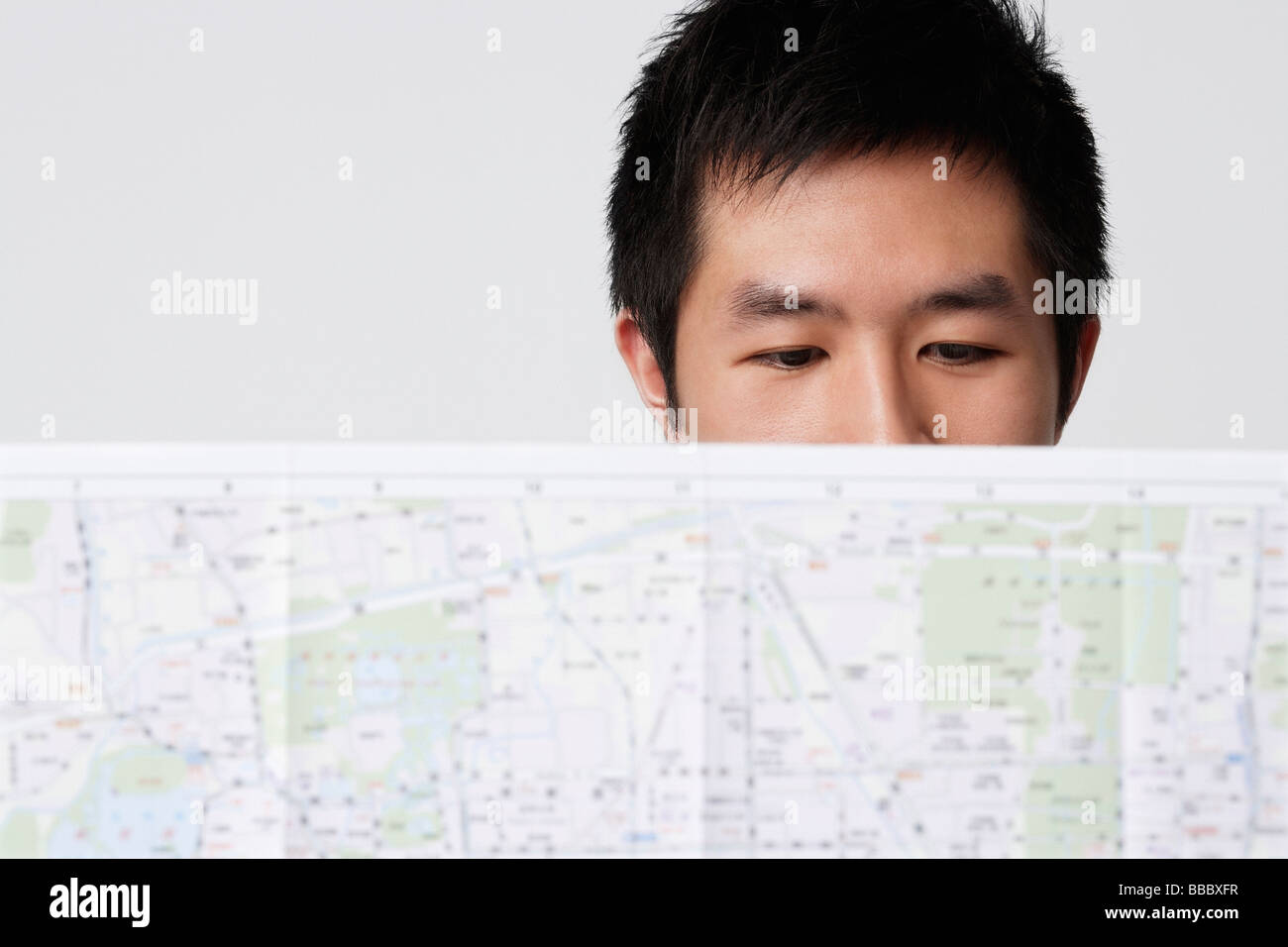 Man with map Stock Photo - Alamy