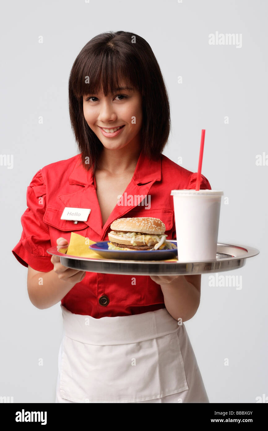 Waitress serving meal Stock Photo - Alamy