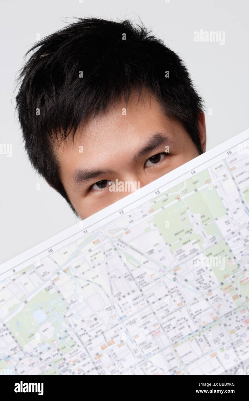Man with map Stock Photo - Alamy