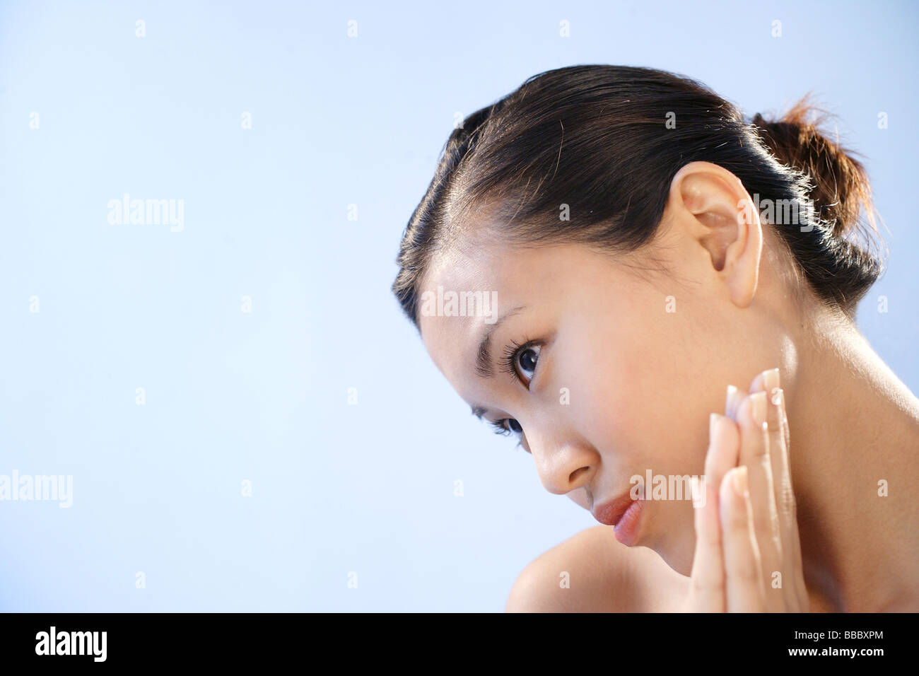 Woman looking away, head bent down Stock Photo - Alamy