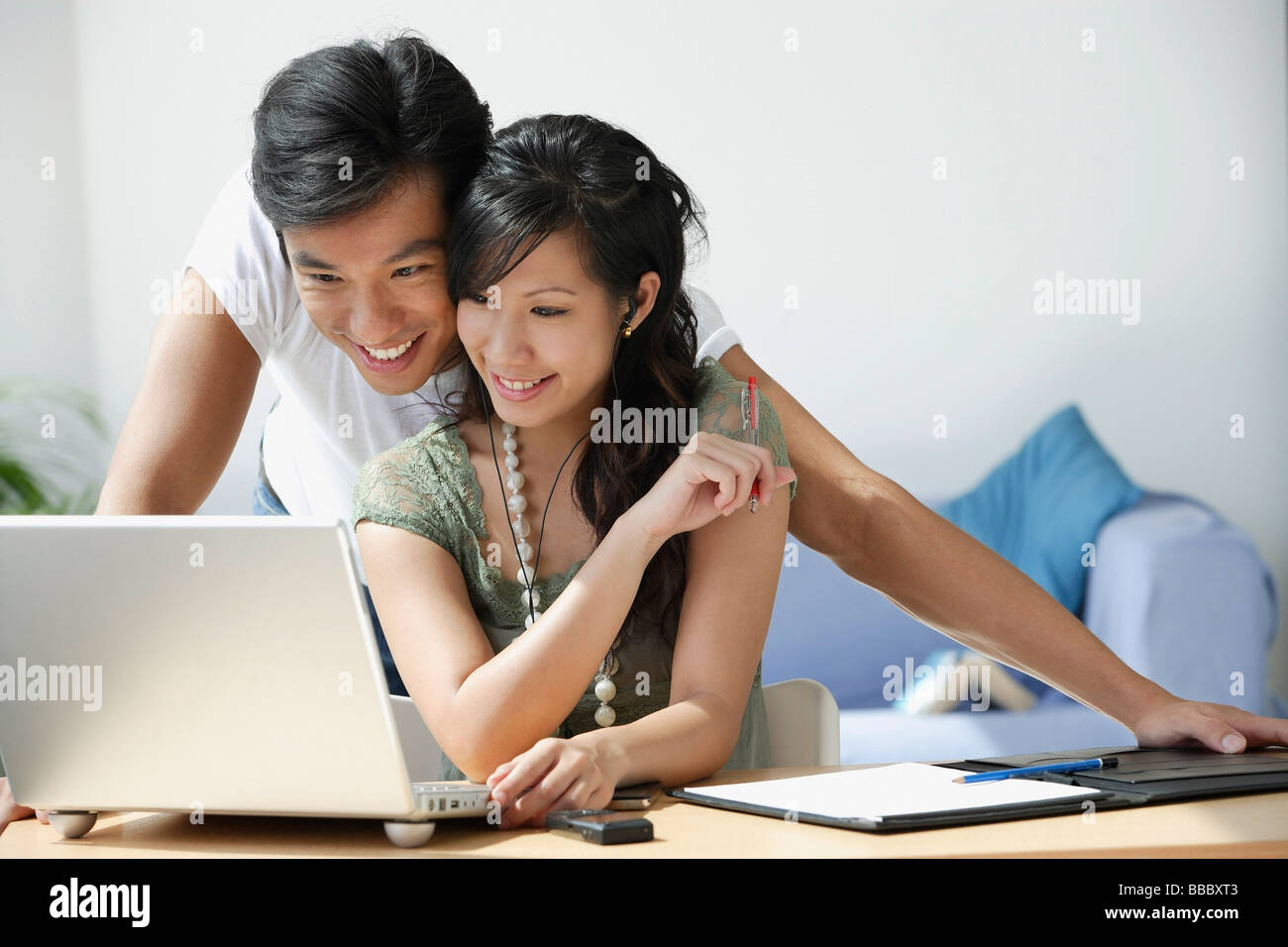 Young couple working at computer Stock Photo - Alamy