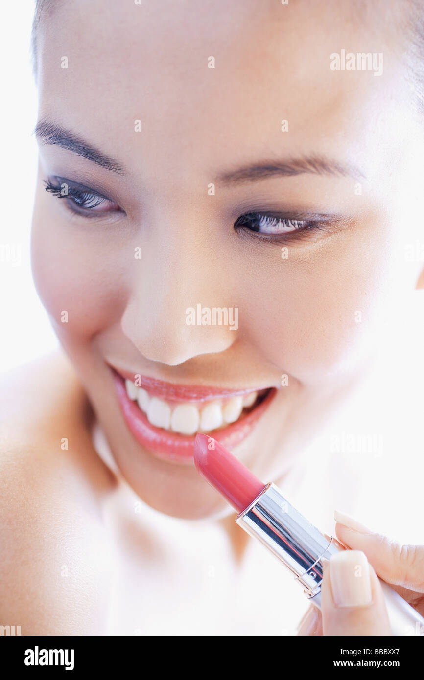 Holding lipstick hi-res stock photography and images - Alamy