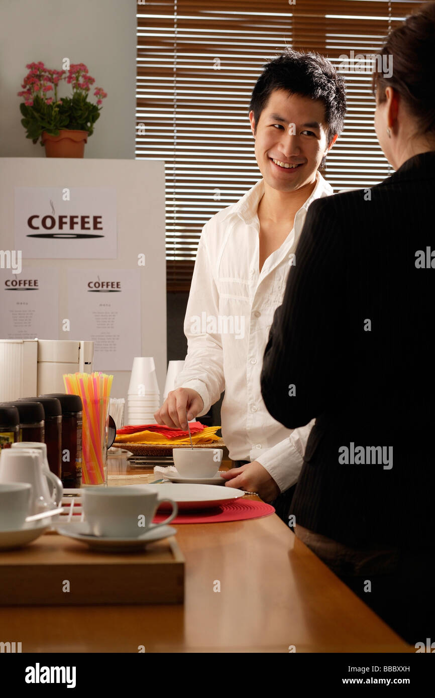 Colleagues chatting on coffee break Stock Photo - Alamy