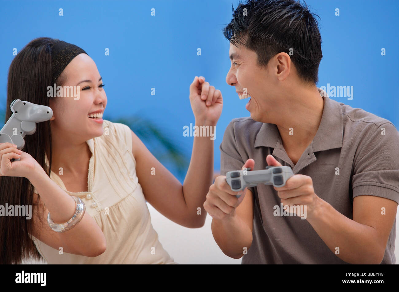 Couple playing video games Stock Photo - Alamy
